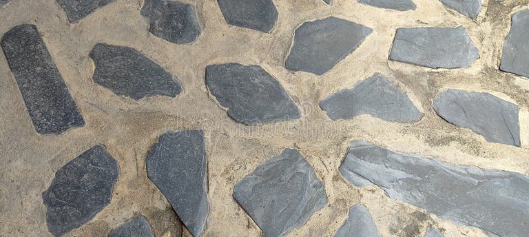The Footpath Surface is Paved with Cement and Marble Tiles with a Dark ...