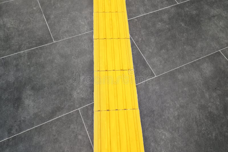 Footpath or Yellow Tactile Tiles for the Blind in Building Space, Top ...
