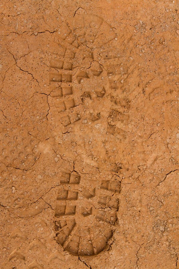 Boot print in brown mud stock photo. Image of sport, symbol - 4903954