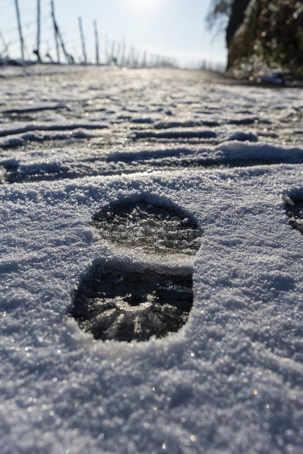 A footprint in the snow stock image. Image of walk, season - 299775243