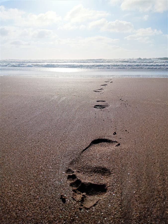 Footprints Emerging Out of the Ocean Stock Photo - Image of summer ...