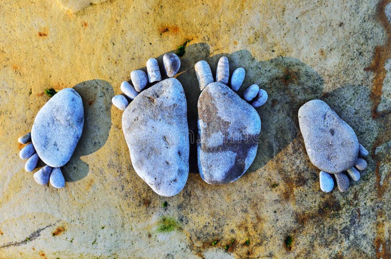 Stone footprints stock image. Image of green, coast, barefoot - 34783235