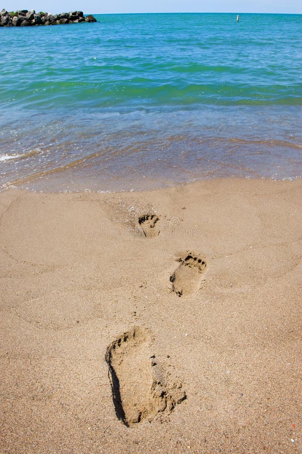 Footprints Leading into the Ocean Stock Photo - Image of imprint, peace ...
