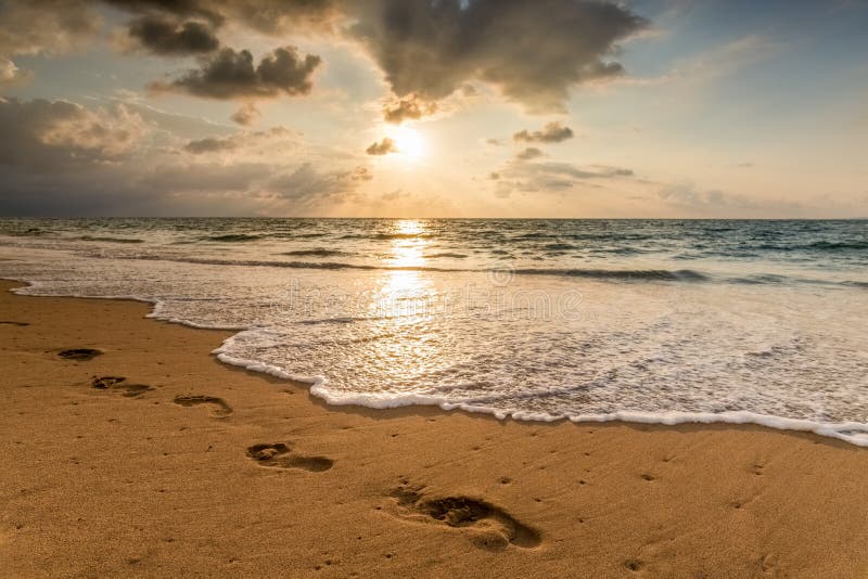 Footsteps in the Sand stock photo. Image of rays, search - 200225654