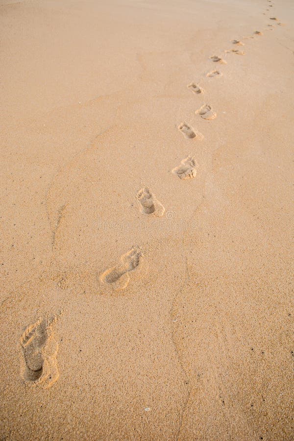 Footprints in the Sand by a Road Stock Photo - Image of figure, sand ...