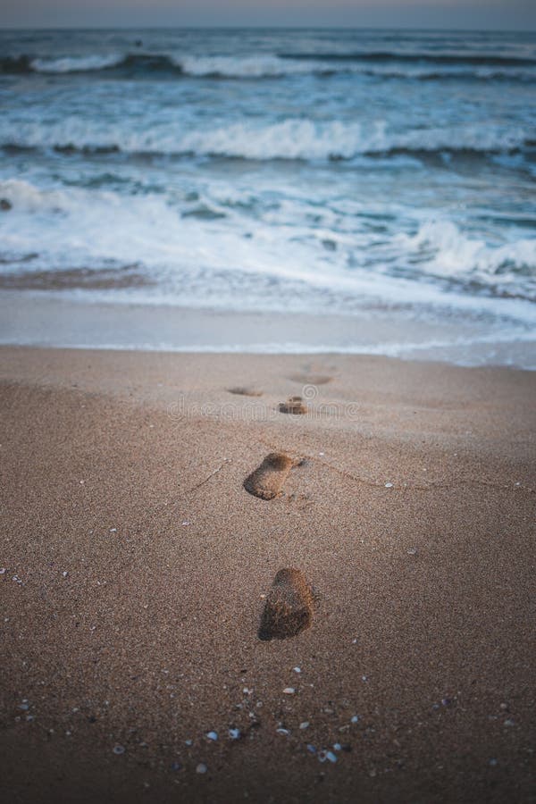 Footprints in the Sand. Waves. Stock Photo - Image of asphalt, steps ...