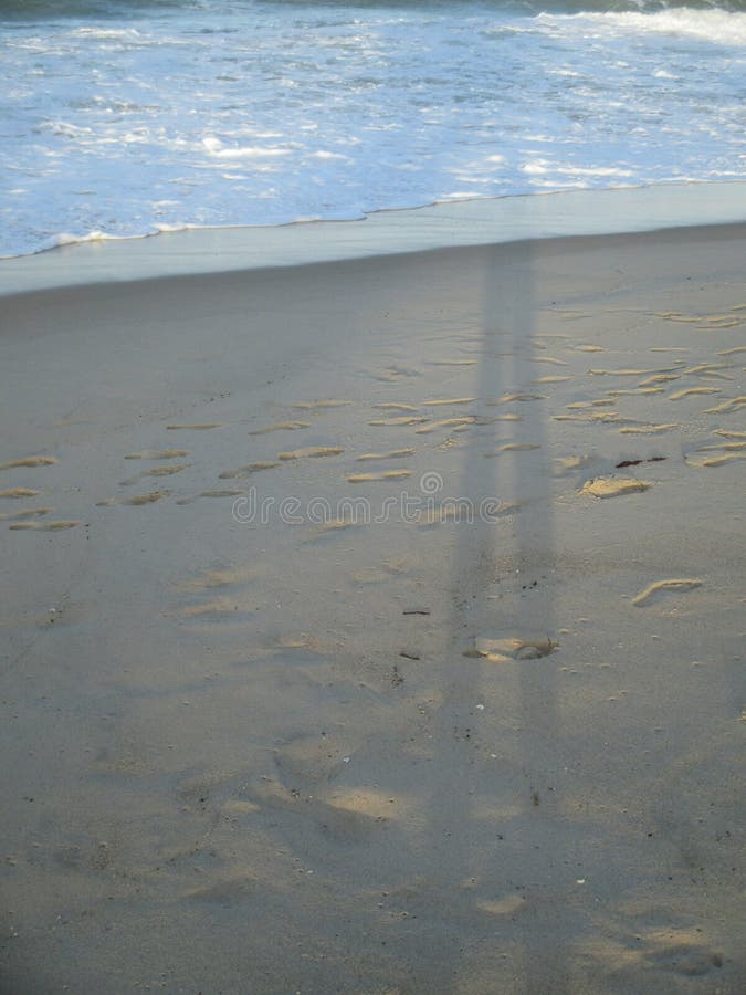 Footprints and Shadow on the Sand of the Beach Stock Photo - Image of ...