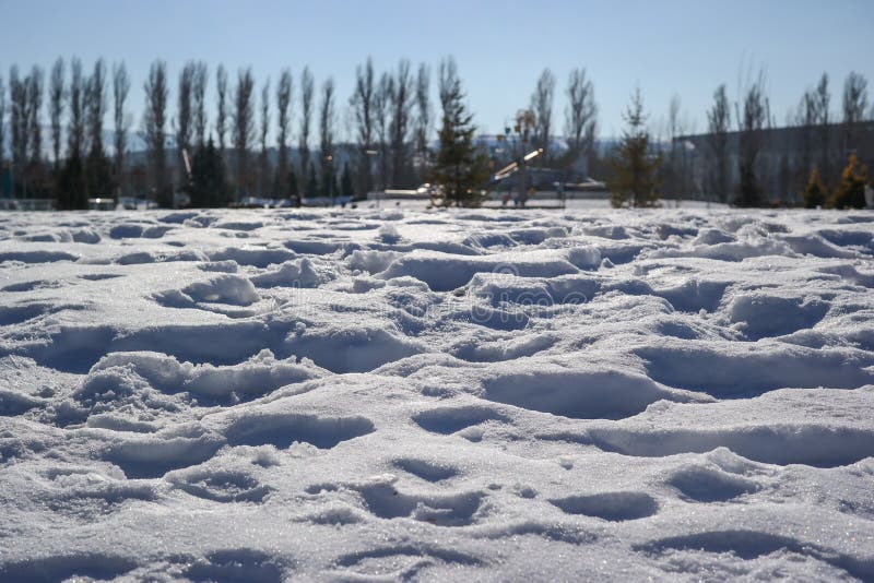 Footprints on snowy ground stock photo. Image of winter - 188526196