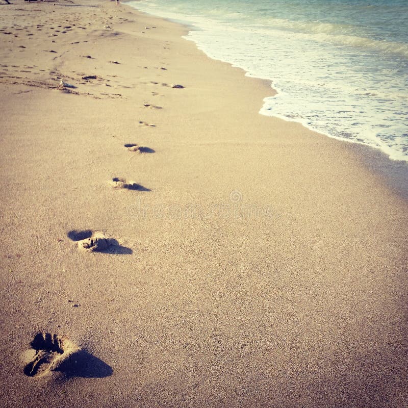 Footsteps on the Beach Perspective Stock Photo - Image of families ...