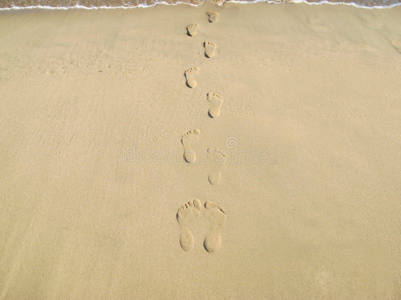 Footsteps on the beach stock image. Image of nature, coastline - 34631843