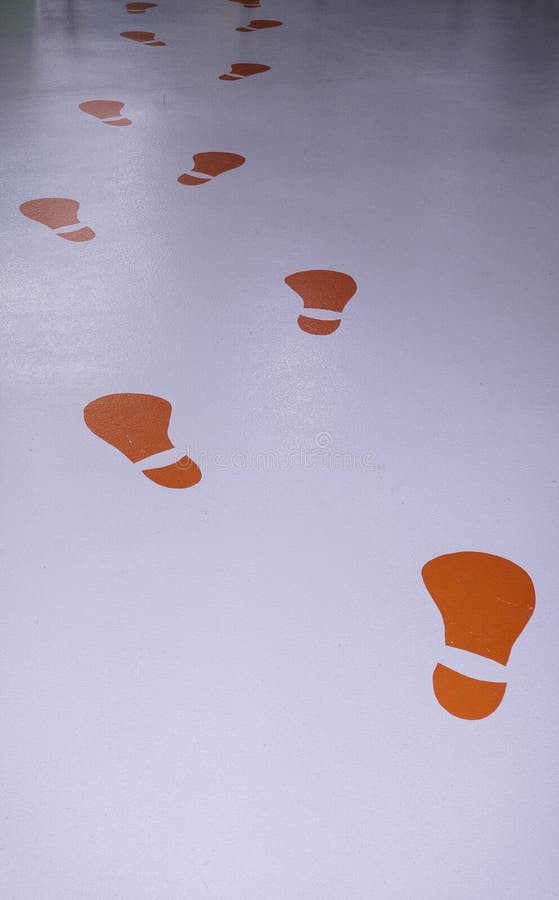 Footsteps in orange color stock photo. Image of shoeprint - 101236996