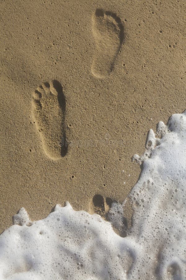 Footsteps in the sand stock image. Image of shadow, photo - 20998559