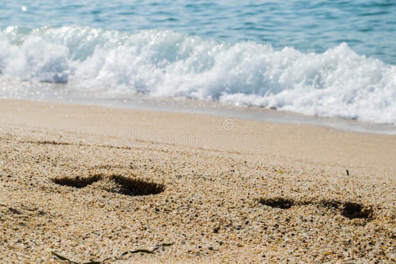Footsteps on the Sand Beach, Sea on Background Stock Image - Image of ...