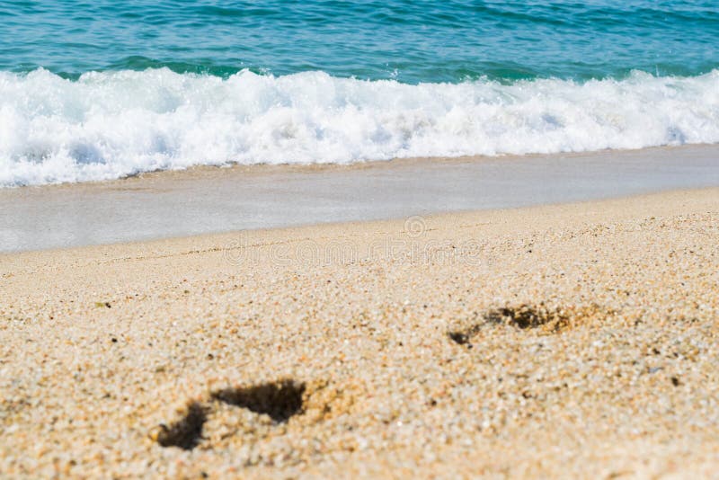 Footsteps on the Sand Beach, Sea on Background Stock Photo - Image of ...
