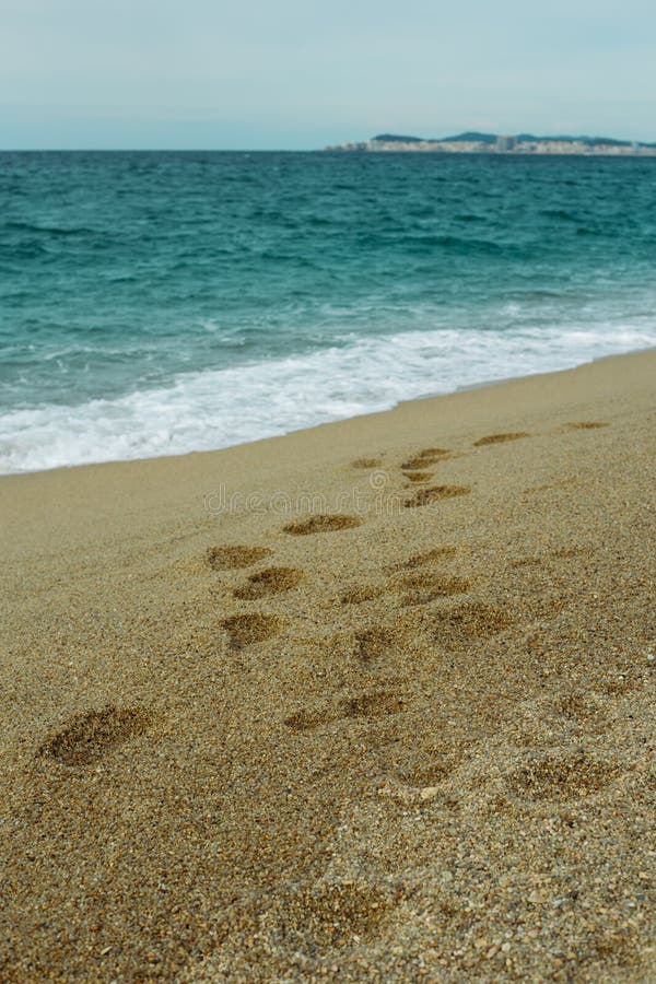Footsteps on the Sand in the Shore of a Beach with Quiet Waters in Costa Brava Stock Image ...
