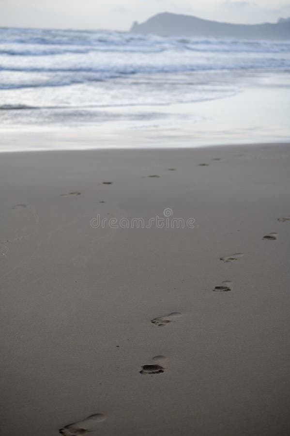 Footsteps on Sandy Beach and Stormy Sea Waves at Winter Stock Image ...
