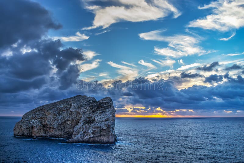 Foradada Island Under a Cloudy Sky Stock Photo - Image of dramatic ...