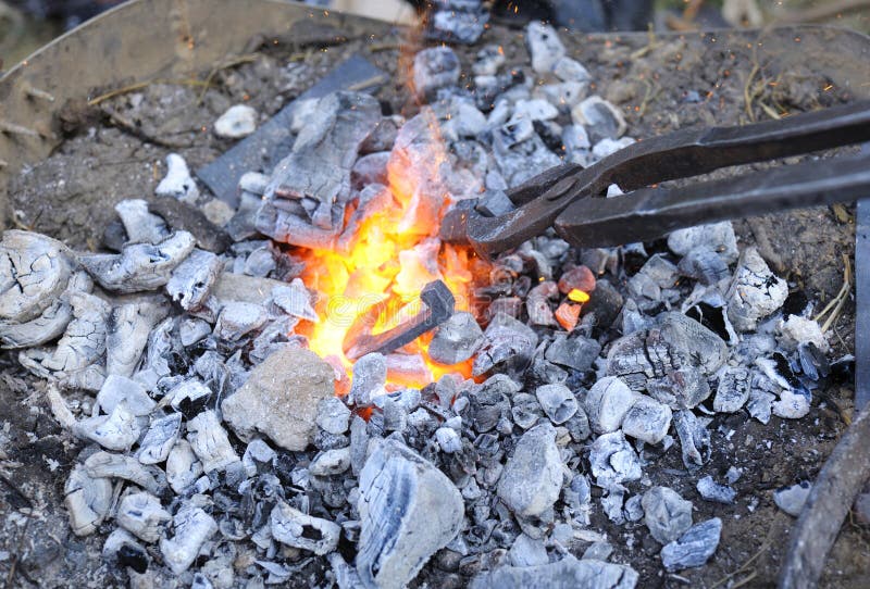 Forceps with a Metal Billet Prepared for Forging in a Burning Forge ...