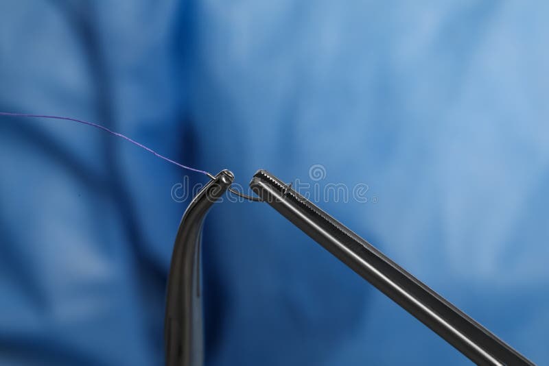 Forceps with Suture Thread and Bandage Roll on Light Blue Background ...