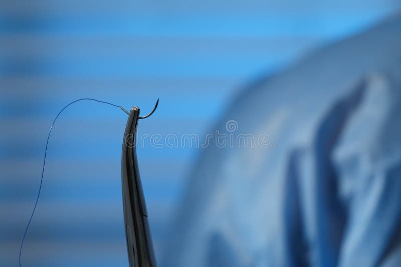 Forceps with Suture Thread and Bandage Roll on Light Blue Background ...