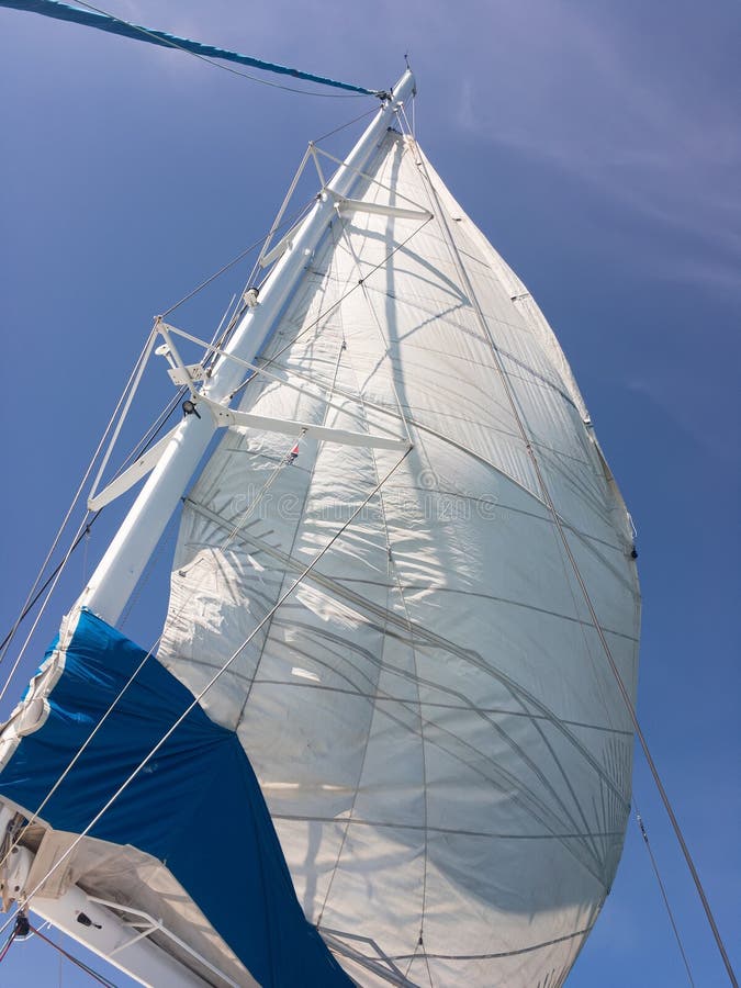 Fore Sail of Catamaran Ship in Wind, Blue Sky, Vertical Stock Photo ...