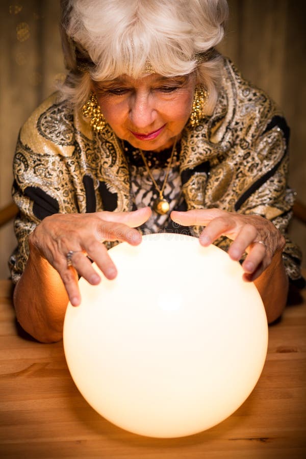 Seer with Crystal Ball and Rays of Light Stock Image - Image of ...