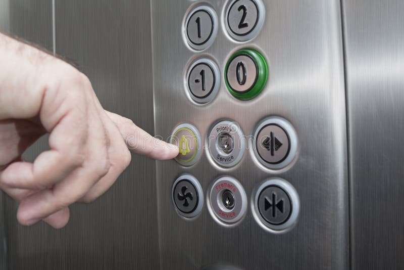 Forefinger Pressing the Alarm Button in the Elevator Stock Photo ...