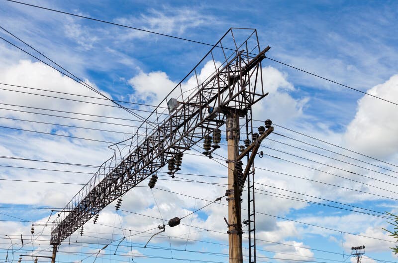 Railway Catenary Against a Blue Sky and Sun Stock Photo - Image of ...