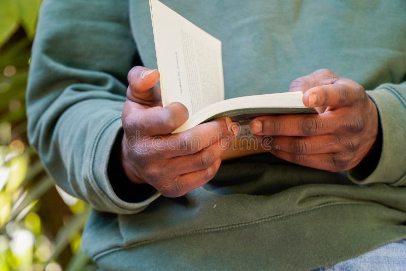Unrecognizable African Person Reading a Book. Black Man Education Stock ...