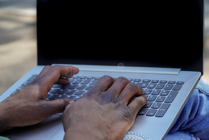 Foreground of a Black Hands Working with a Laptop. Digital Nomad Stock ...