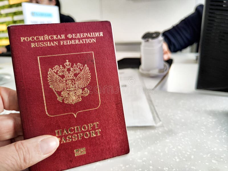 Foreign Passport of a Russian Citizen Being Presented at a Border ...