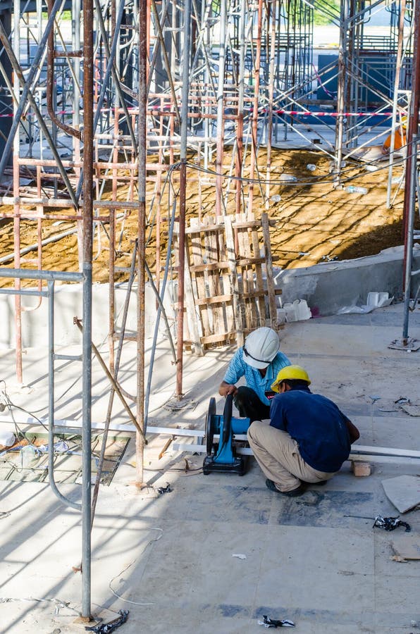 Foreign Workers Cutting Construction Material Stock Photo - Image of ...