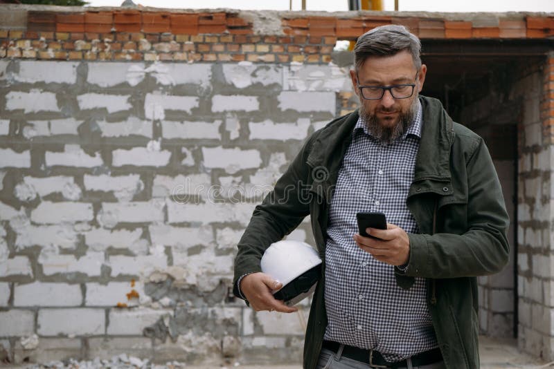 Foreman or Architect on Construction Site with Mobile Phone Stock Image ...