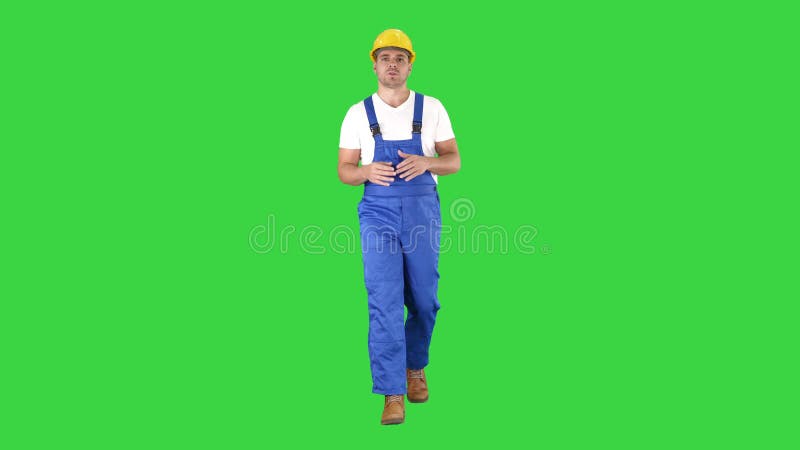 Foreman Builder Explaining Something To Camera and Talking on a Green ... Foreman Builder Explaining Something To Camera and Talking on a Green ...