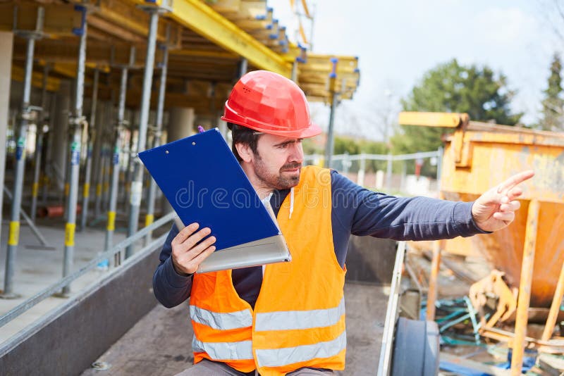 Foreman with Checklist Gives Instructions on Construction Site Stock ...