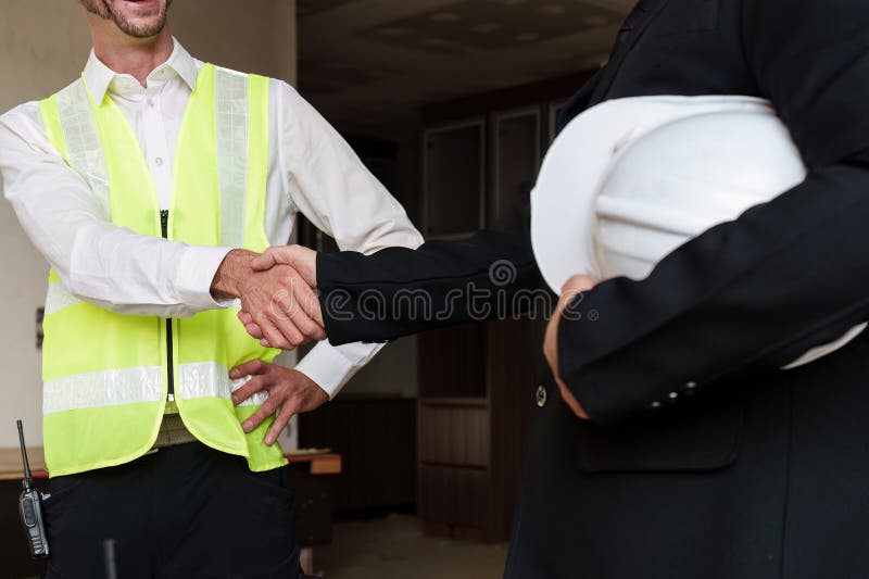 Foreman or Civil Engineer Handshake Making Modern Construction ...
