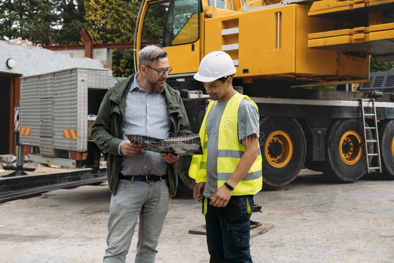 Foreman and Client Discussion Work on Construction Site Architect with ...