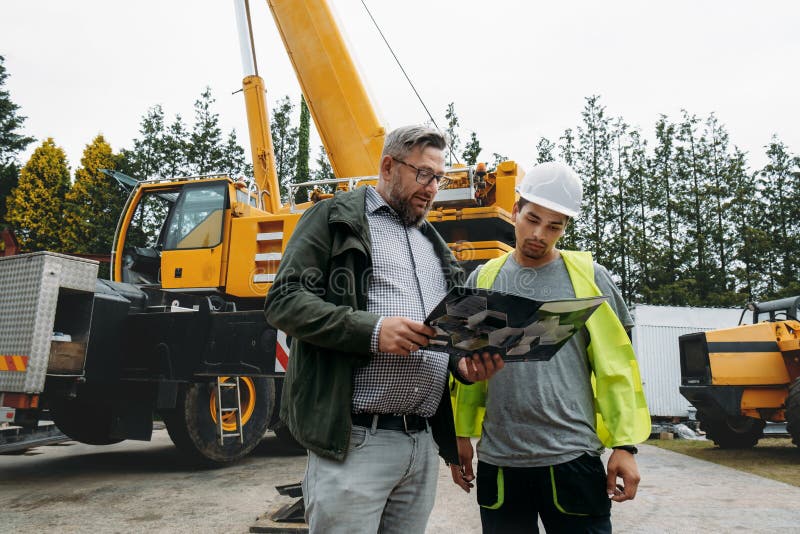 Foreman and Client Discussion Work on Construction Site Architect with ...