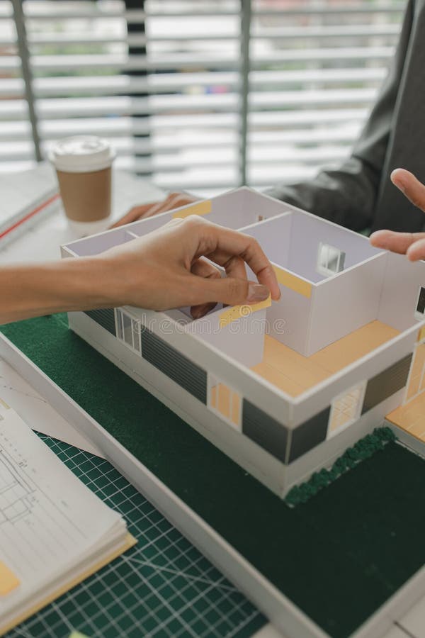 A Foreman is Consulting with an Engineer about House Structure, N ...