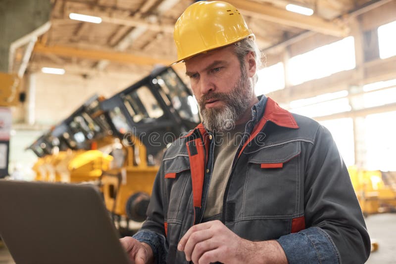 Foreman Controlling the Equipment with Laptop Stock Image - Image of ...