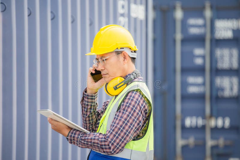 Foreman Dock Worker in Hardhat and Safety Vest Checking Containers Box ...