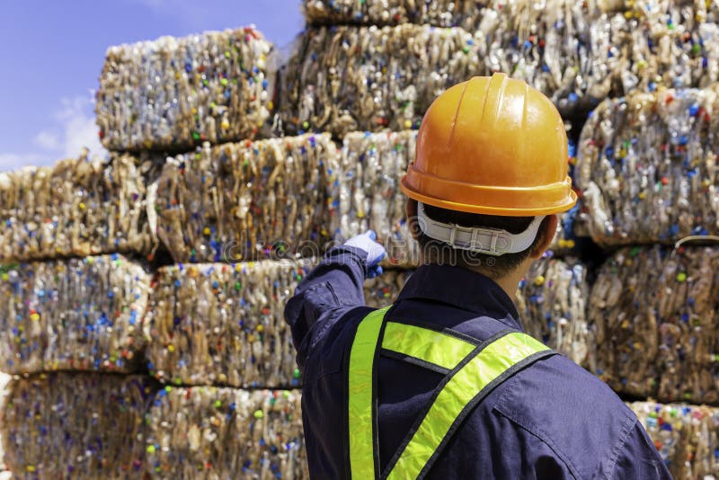 Engineer Standing and Looking Back the Plastic Bottle in the Recycling ...