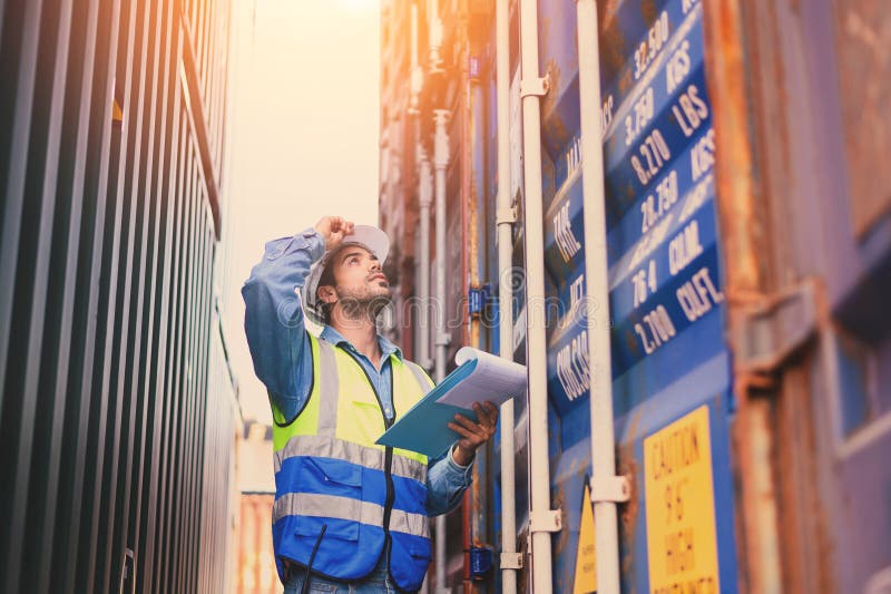 Foreman or Engineer Wears White Helmet and Reflection Shirt To Control ...