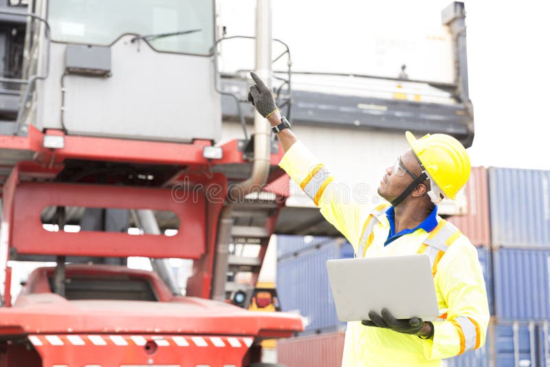 Foreman is Giving a Signal To Work in the Harbor. To Move the Cargo ...
