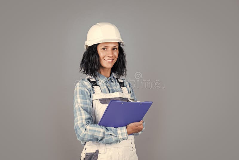 Foreman Inspector. Girl in Checkered Shirt and Protective Hard Hat ...