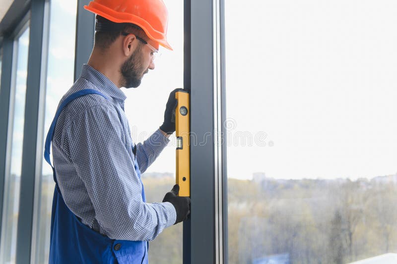 The Foreman Installs a Window Frame in the Room Stock Image - Image of ...
