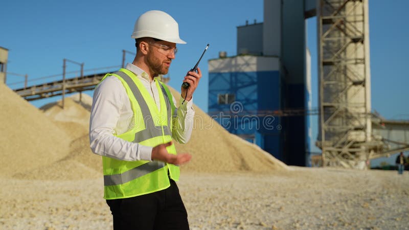 Foreman Instructing Workers Using Walkie Talkie Radio Set at Quarry ...