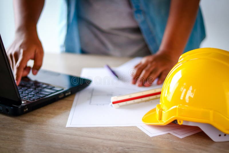 Foreman, Look at the Computer Used To Draw Construction Drawings. Stock ...