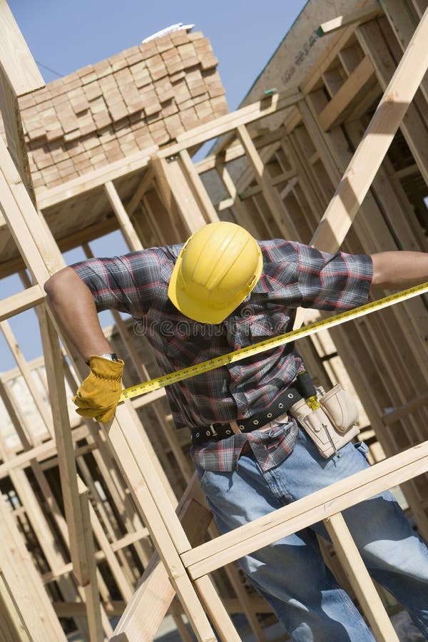 Construction Worker Hammering Nail On Timber Frame Stock Photo - Image ...