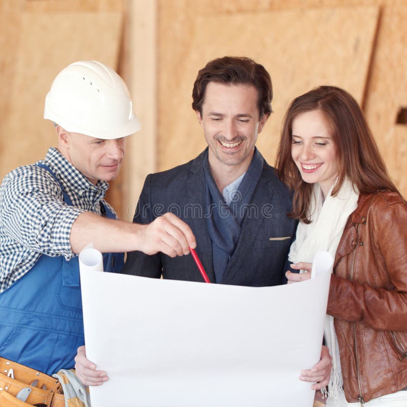 Foreman shows house plans stock photo. Image of holding - 164136498